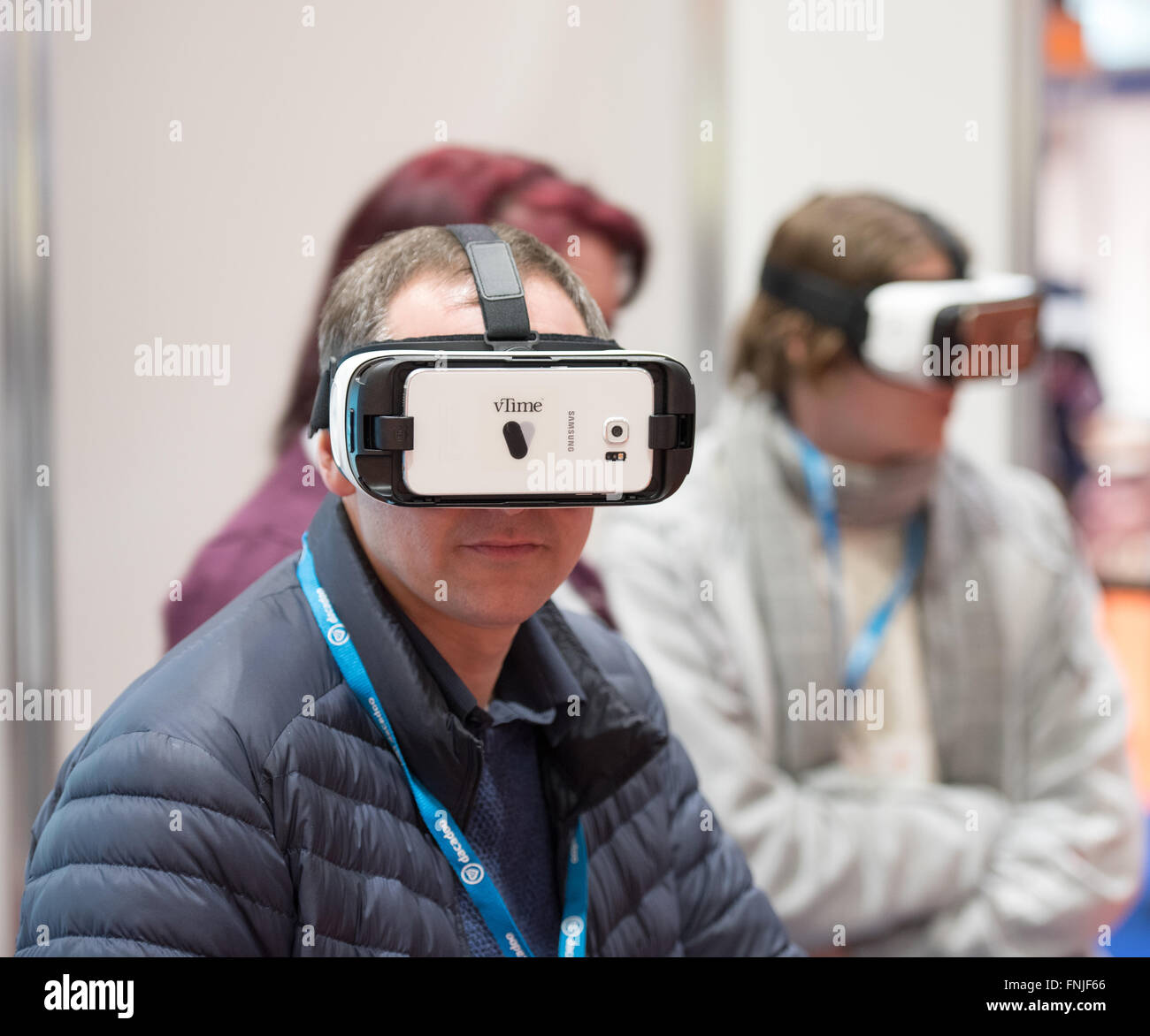 London, UK 15th March 2016, Wearable Technology Show, visitor tries on ...