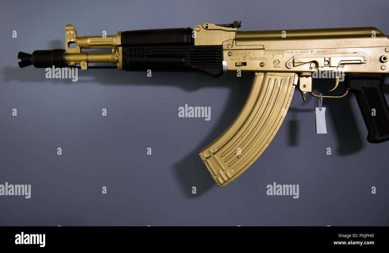Dresden, Germany. 15th Mar, 2016. A golden Kalashnikov rifle is on ...