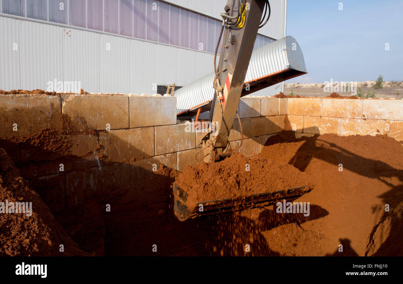 Boxberg, Germany. 14th Mar, 2016. An excavator is used to move iron ...