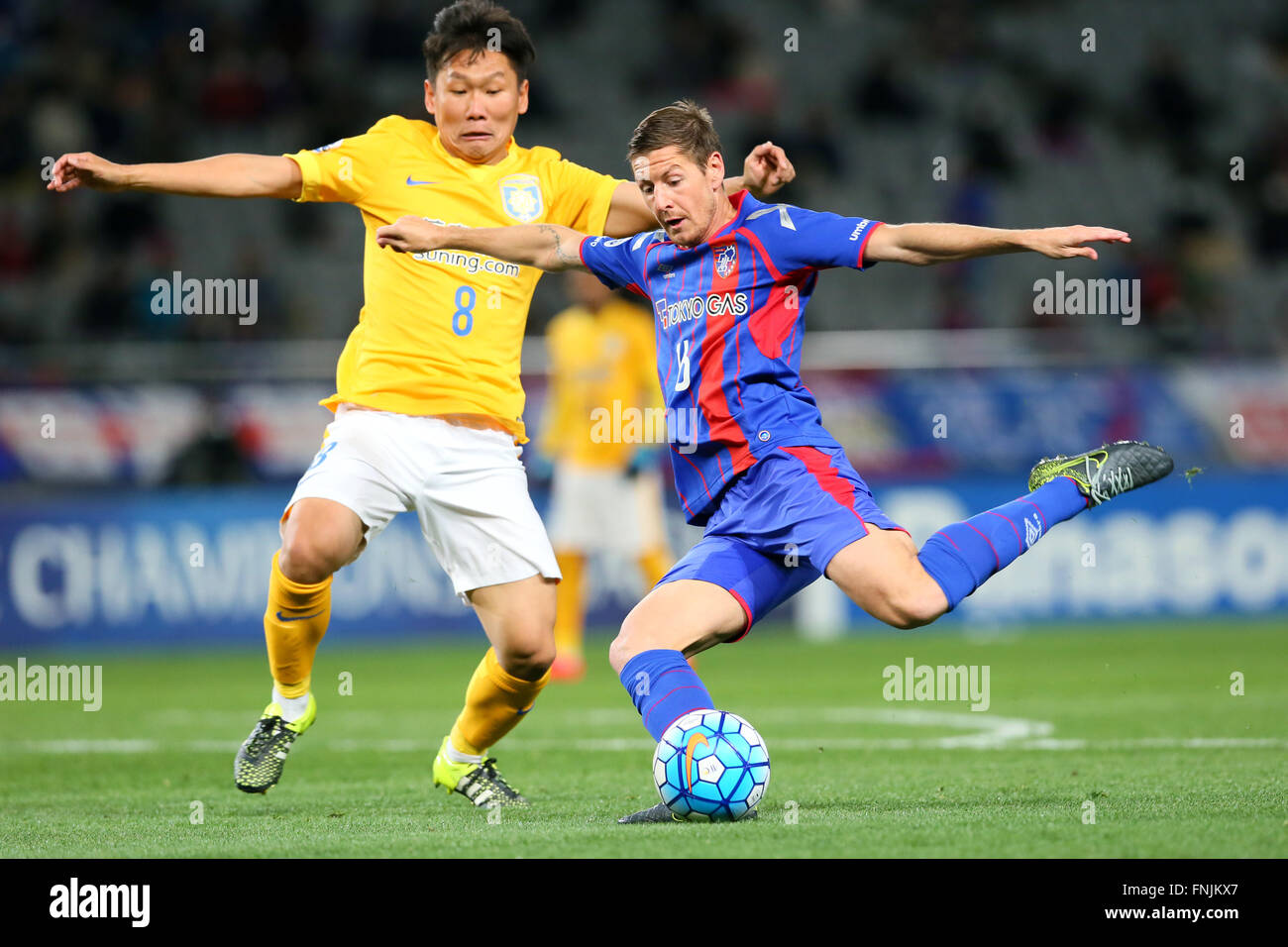 Tokyo, Japan. 15th Mar, 2016. (L-R) Liu Jianye (Suning), Nathan Burns ...