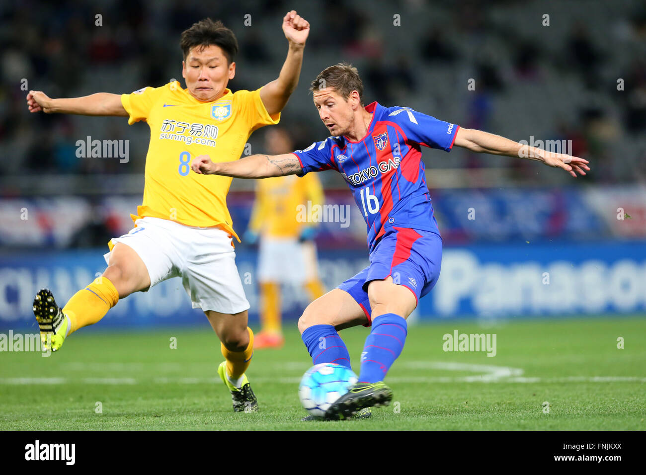 Tokyo, Japan. 15th Mar, 2016. (L-R) Liu Jianye (Suning), Nathan Burns ...