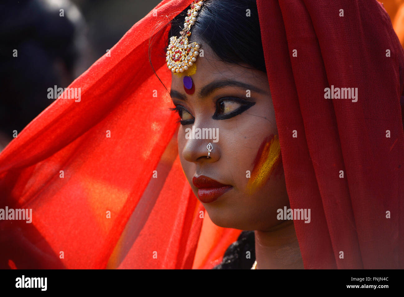 Kolkata, India. 15th Mar, 2016. Student enjoys playing abir ...