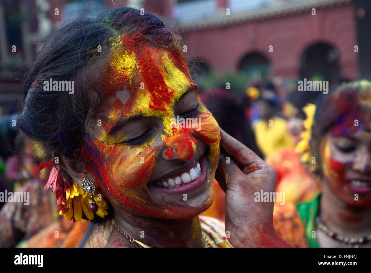 Kolkata, India. 15th Mar, 2016. Student enjoys playing abir ...