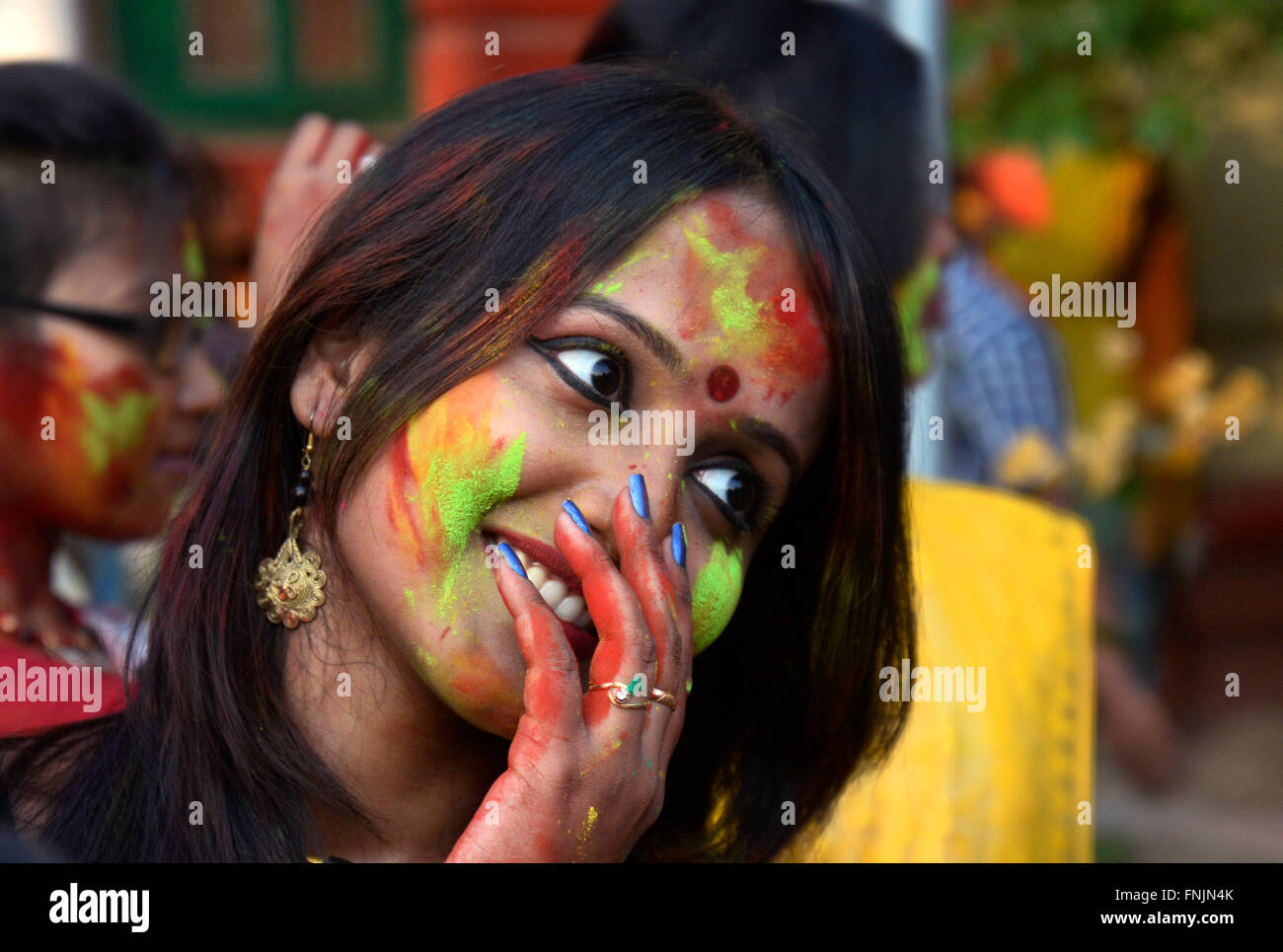 Kolkata, India. 15th Mar, 2016. Student enjoys playing abir ...