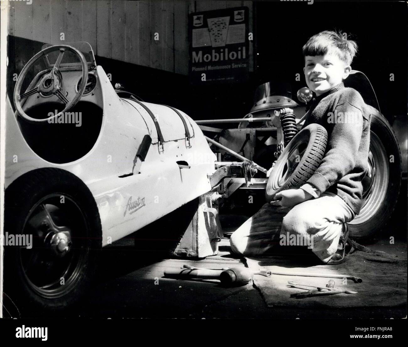 1964 - Britain's youngest racing motorist: Bob Rayner changes a wheel ...