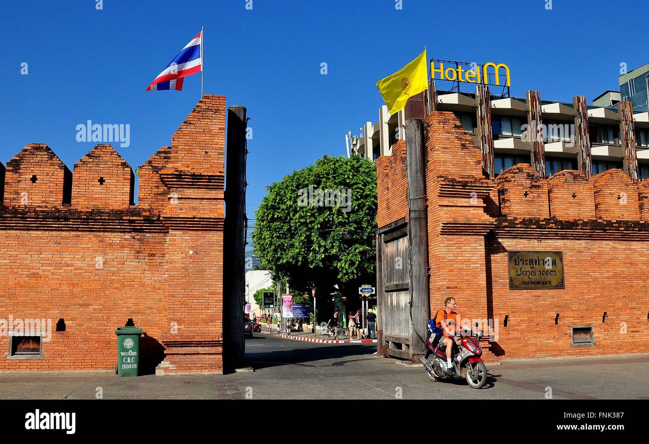 Chiang Mai, Thailand: A motorcylist driving past the Tha Phae Gate and ...