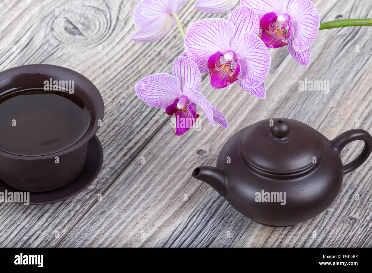 Chinese tea ceremony with ceramic set on wooden table Stock Photo - Alamy