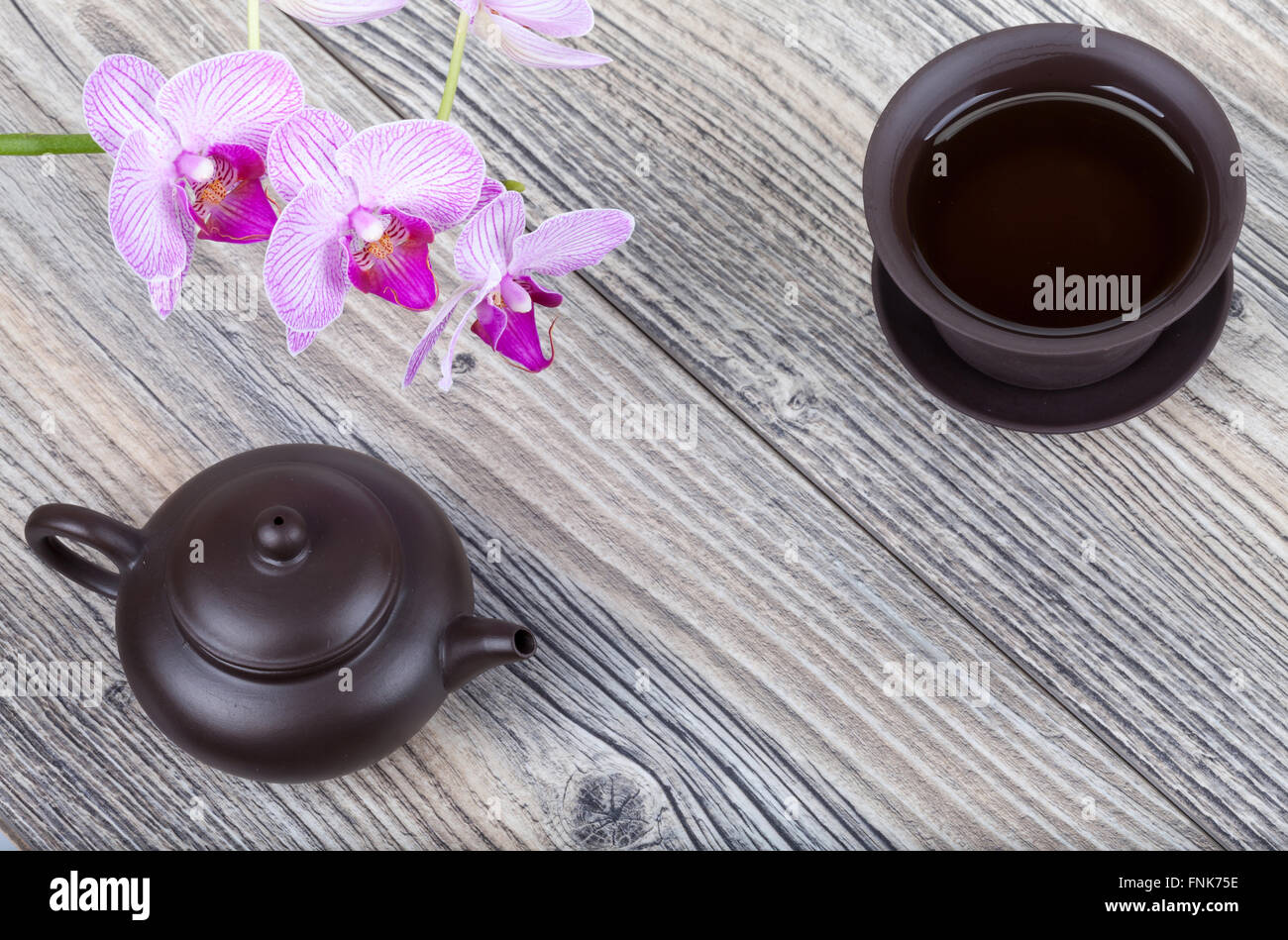 Chinese tea ceremony with ceramic set on wooden table Stock Photo - Alamy