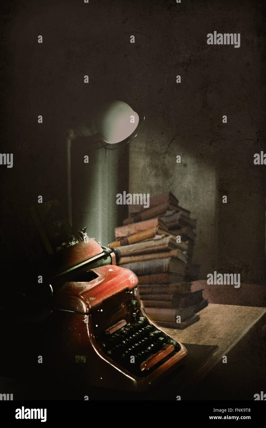 writer's desk with typing machine and old books Stock Photo - Alamy