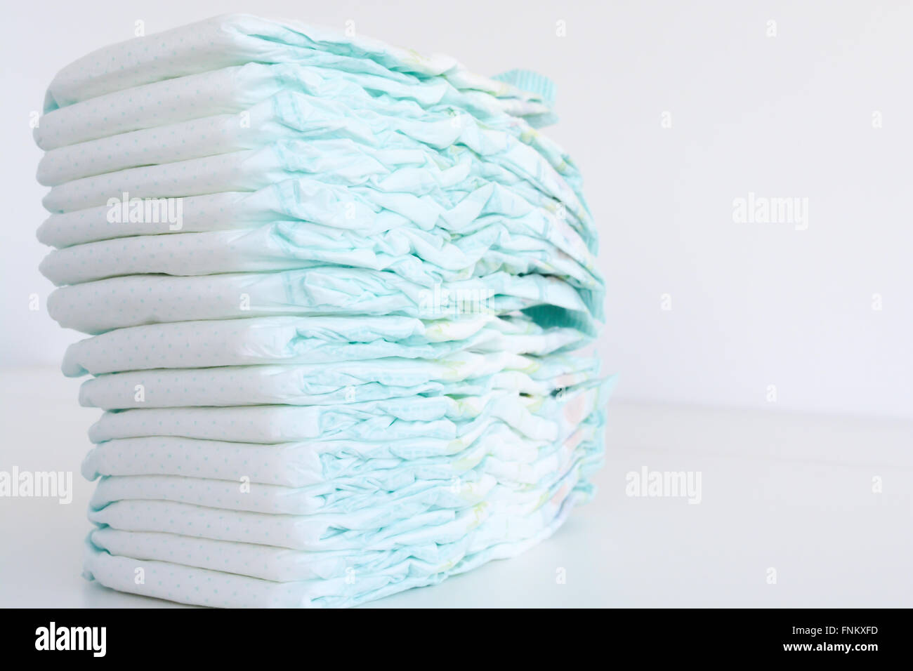 Stack of diapers isolated on white background Stock Photo - Alamy