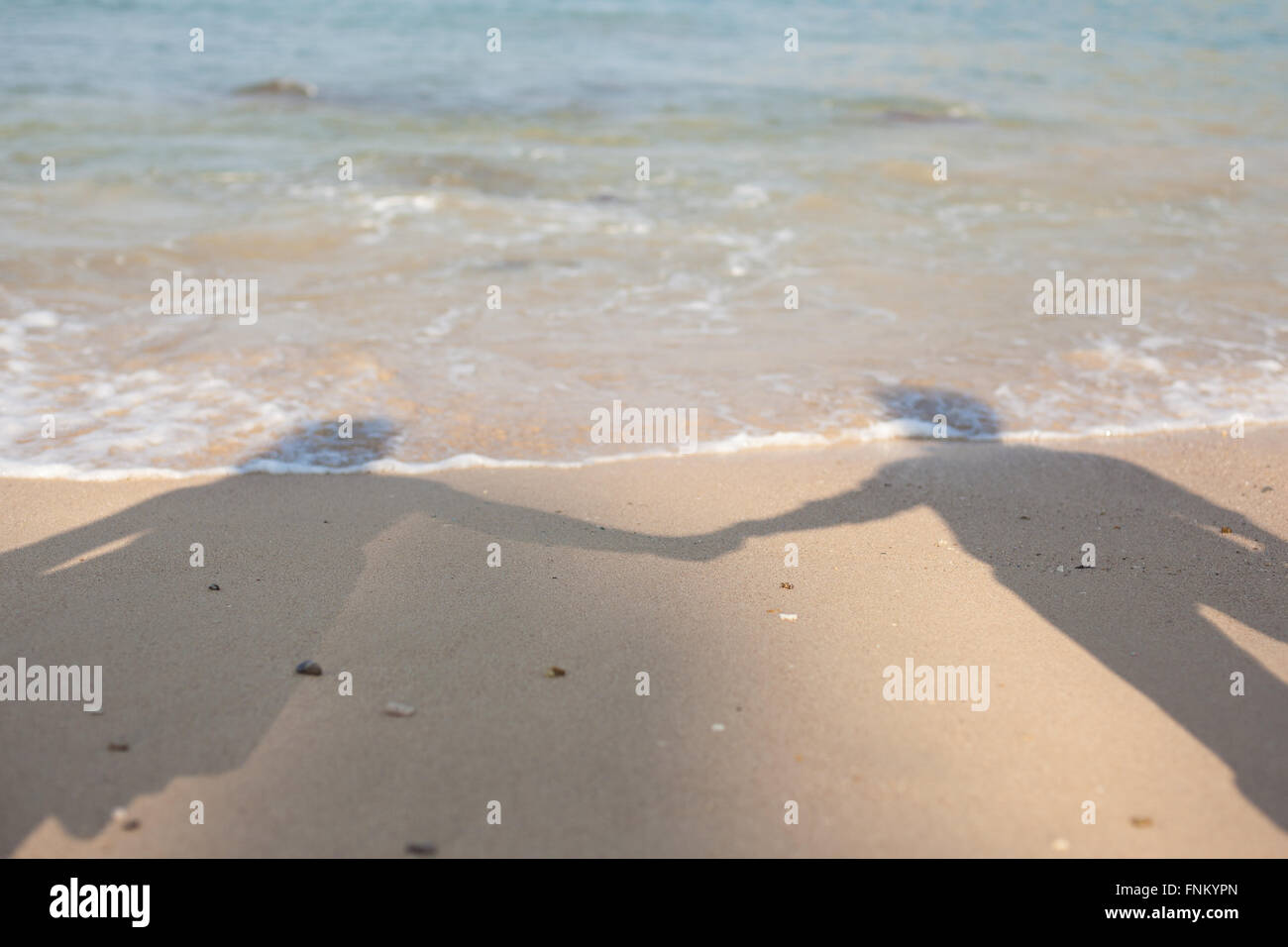 Family shadow beach hi-res stock photography and images - Alamy