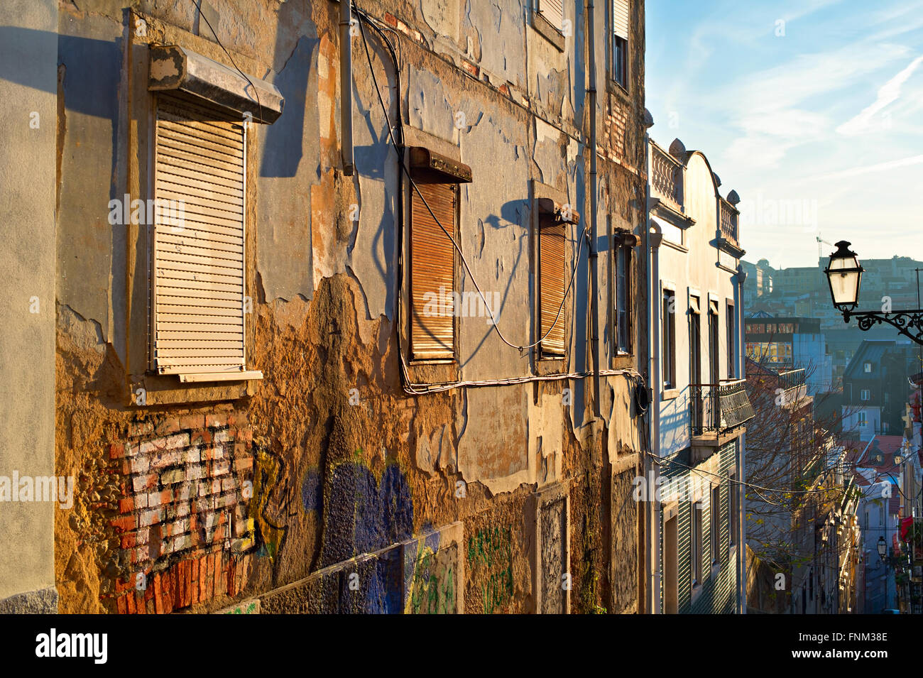 Colorful Old Town wall of Lisbon at sunset. Portugal Stock Photo - Alamy