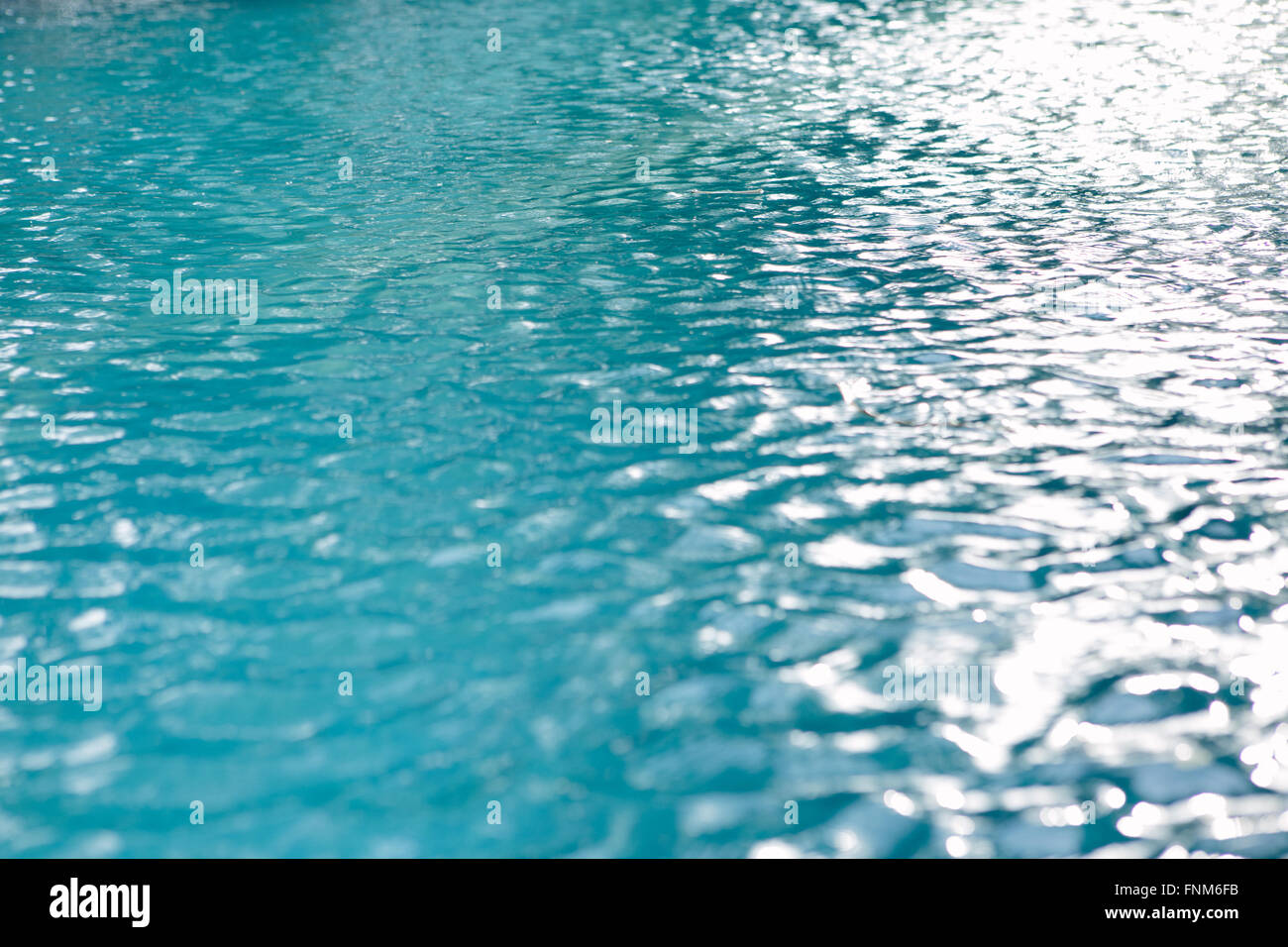 Shimmering swimming pool water at luxury resort Stock Photo - Alamy