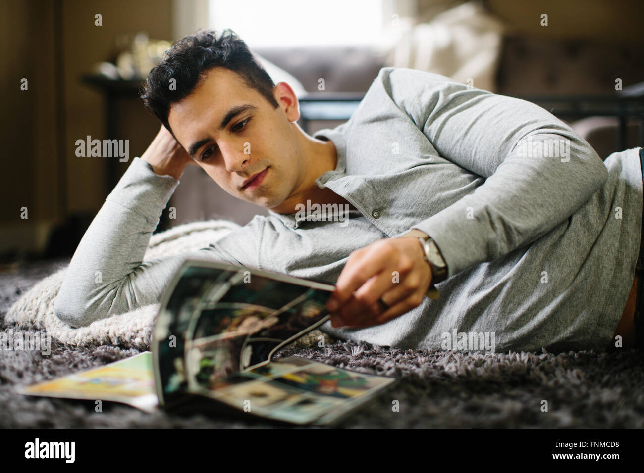 A young man with comics at home Stock Photo - Alamy