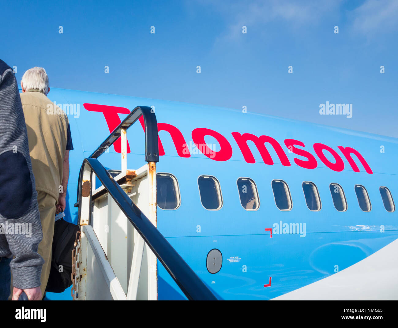 Passengers boarding Thomson flight at Newcastle airport. UK Stock Photo ...