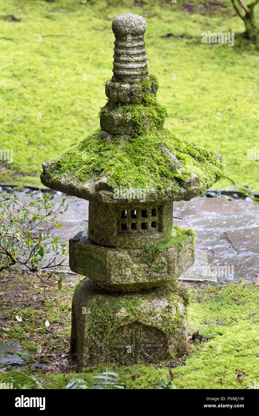 Old Stone Lantern covered in green moss at Japanese Garden Stock Photo ...