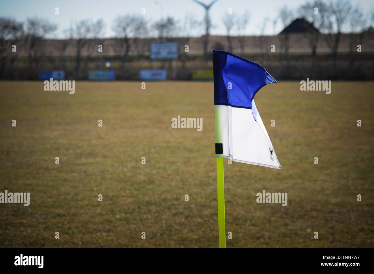 Blue and white corner flag on soccer field Stock Photo - Alamy