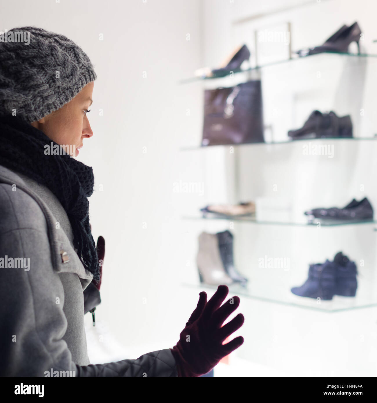 Woman window shopping Stock Photo - Alamy