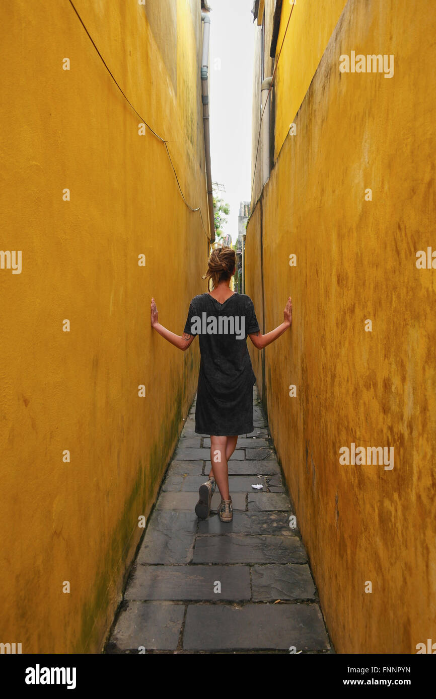 Woman standing between sun hi-res stock photography and images - Alamy
