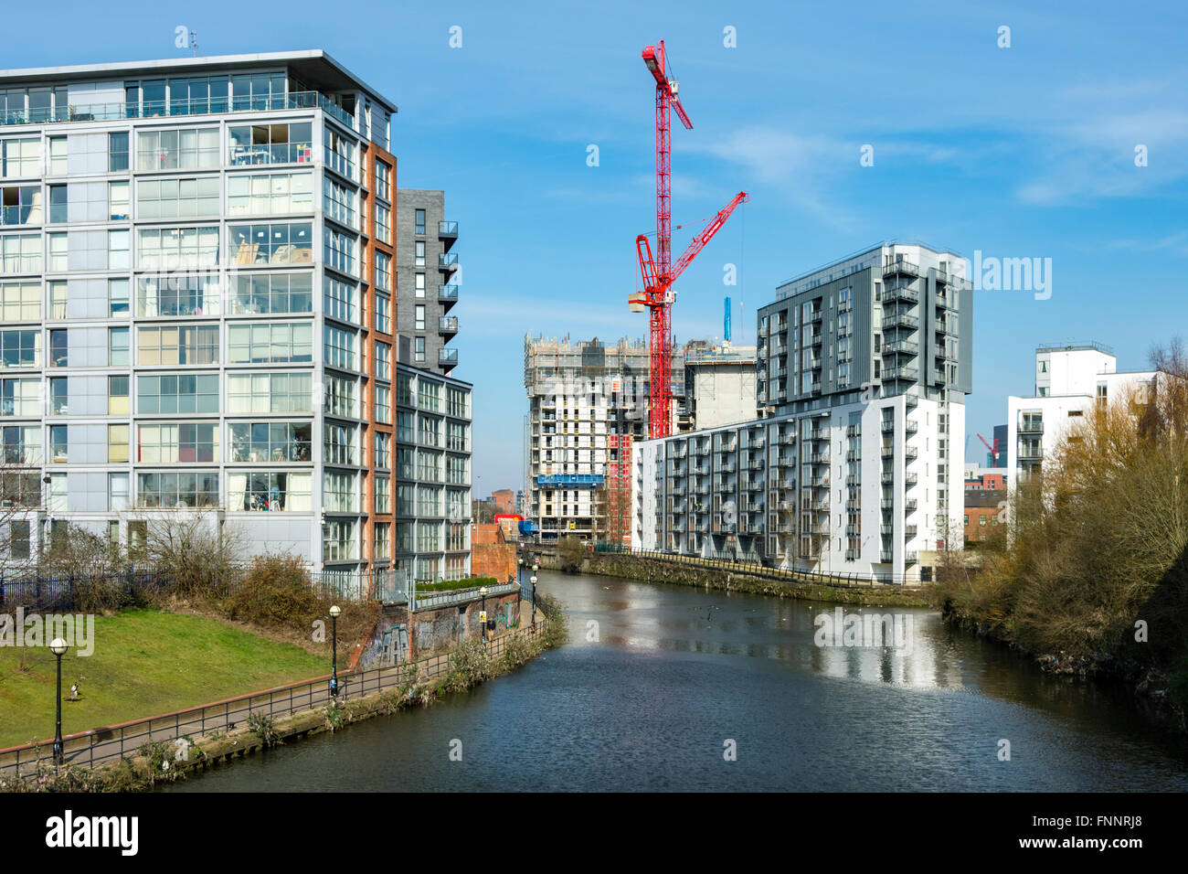 Apartment blocks, built and under construction, by the River Irwell ...