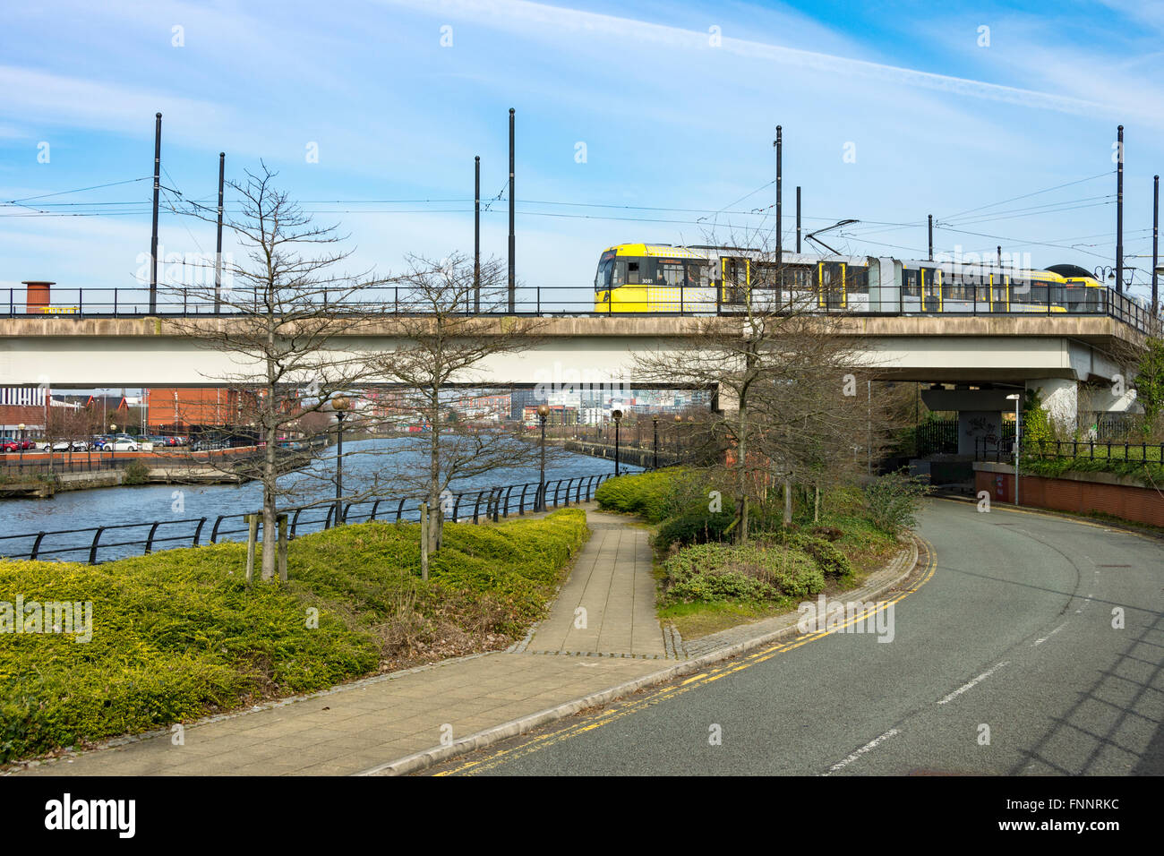 Metrolink tram crossing the river Irwell-Manchester Ship Canal at ...
