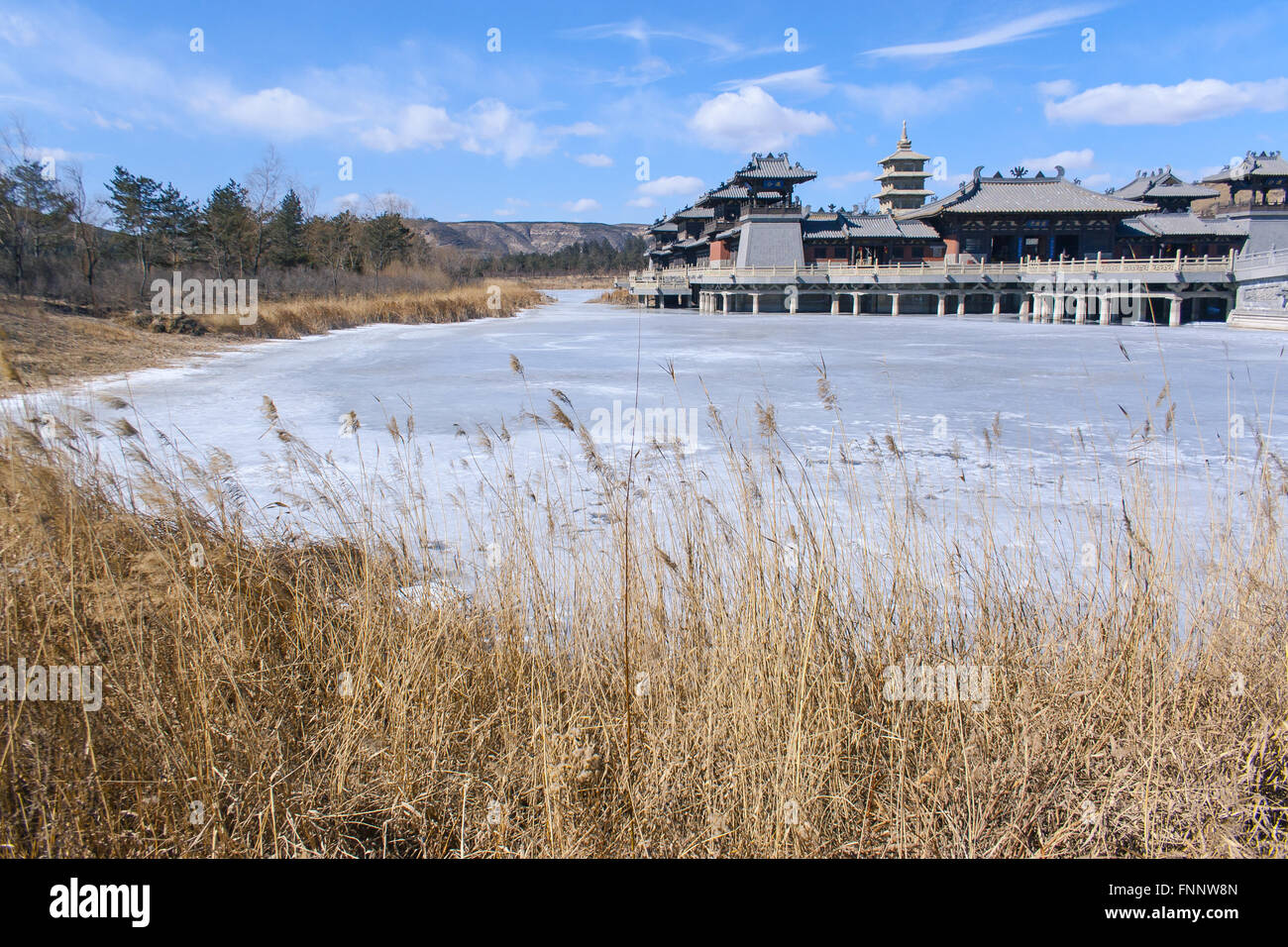 Chinese style antique imitation buildings in the center of the lake ...