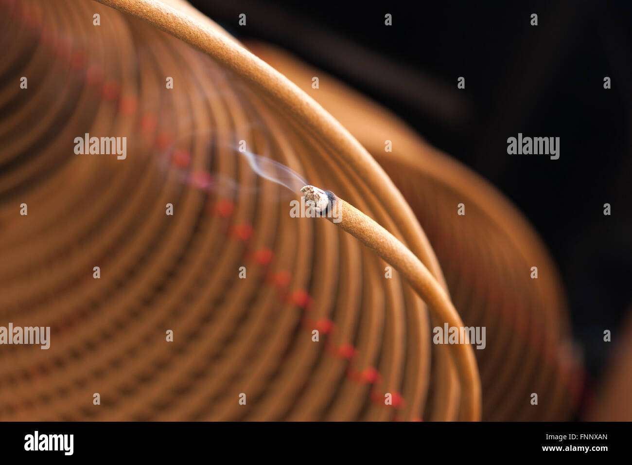 burning chinese circular joss sticks Stock Photo - Alamy
