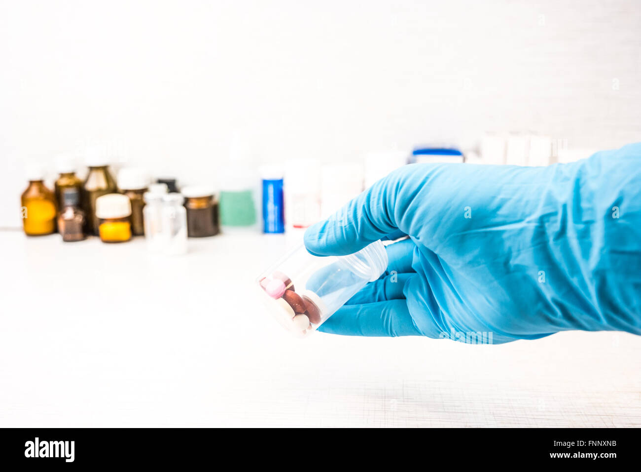 Drugs in a measuring cylinder Stock Photo - Alamy