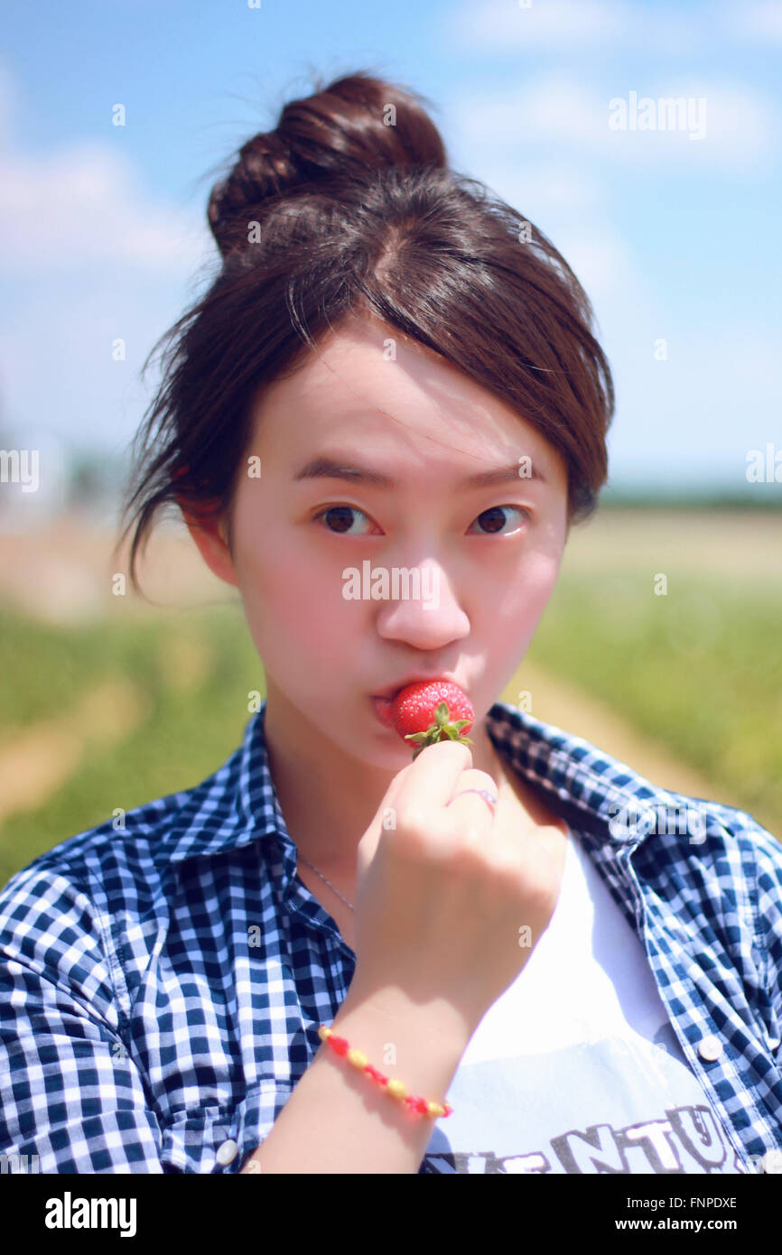 girl and strawberry Stock Photo - Alamy