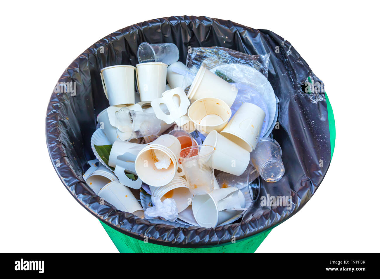 Paper cup in a green trash Stock Photo - Alamy