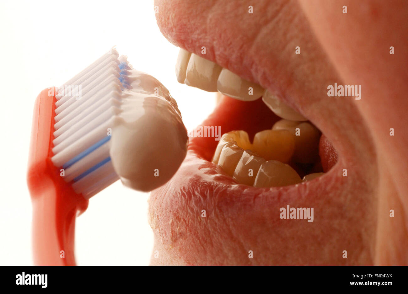 Facial close-up of a woman brushing her teeth Stock Photo - Alamy