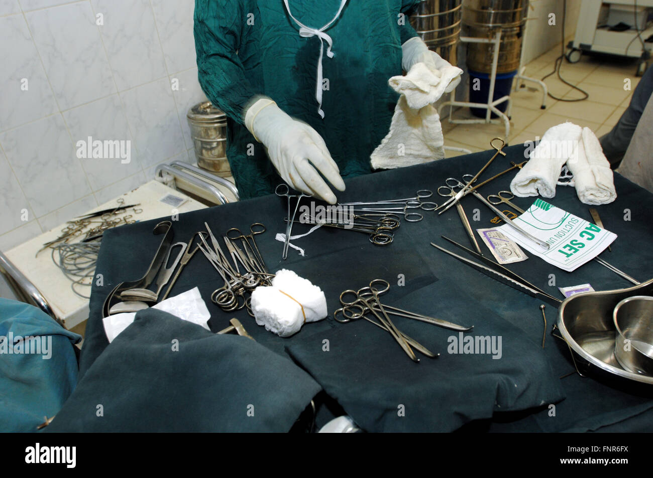 Surgical staff prepare instruments for use in an operation Stock Photo ...