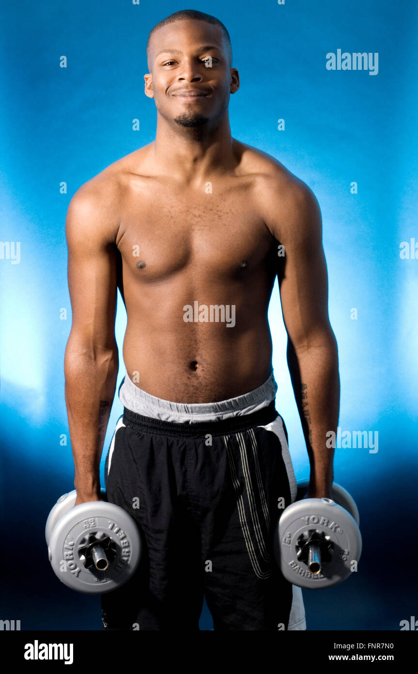 Man in great physical shape working out, toned muscles Stock Photo - Alamy