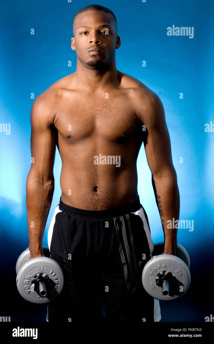 Man in great physical shape working out, toned muscles Stock Photo - Alamy