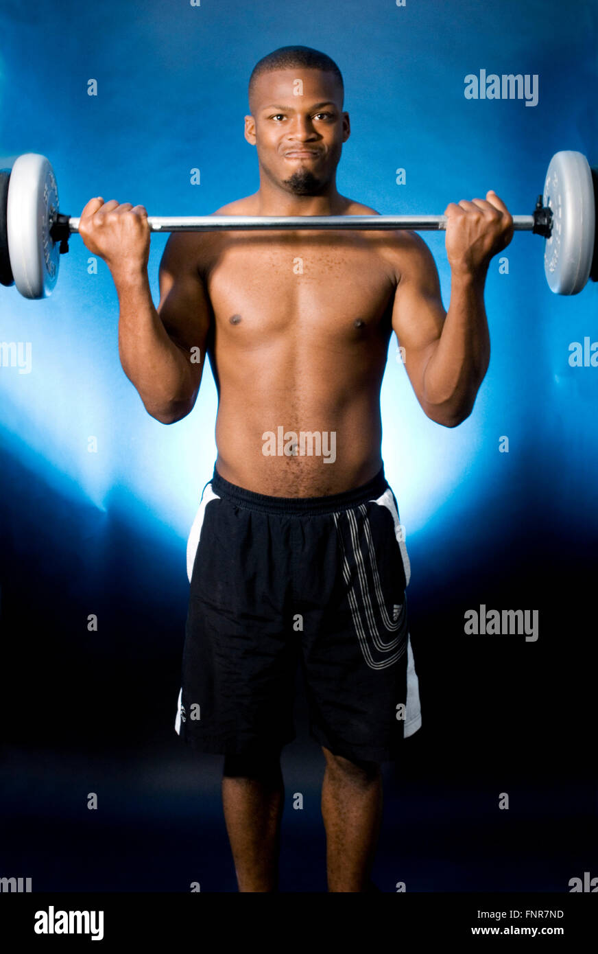 Man in great physical shape working out, toned muscles Stock Photo - Alamy