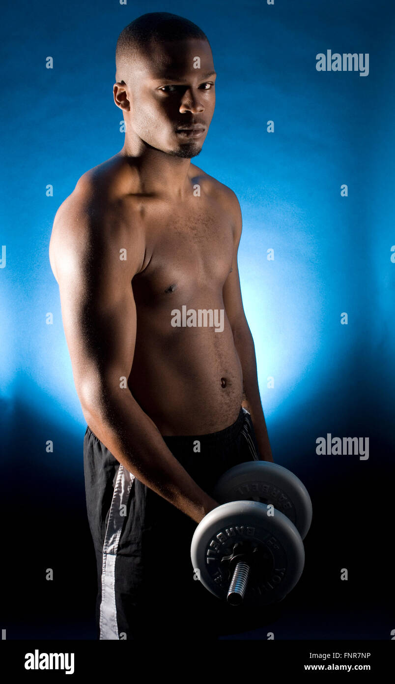 Man in great physical shape working out, toned muscles Stock Photo - Alamy