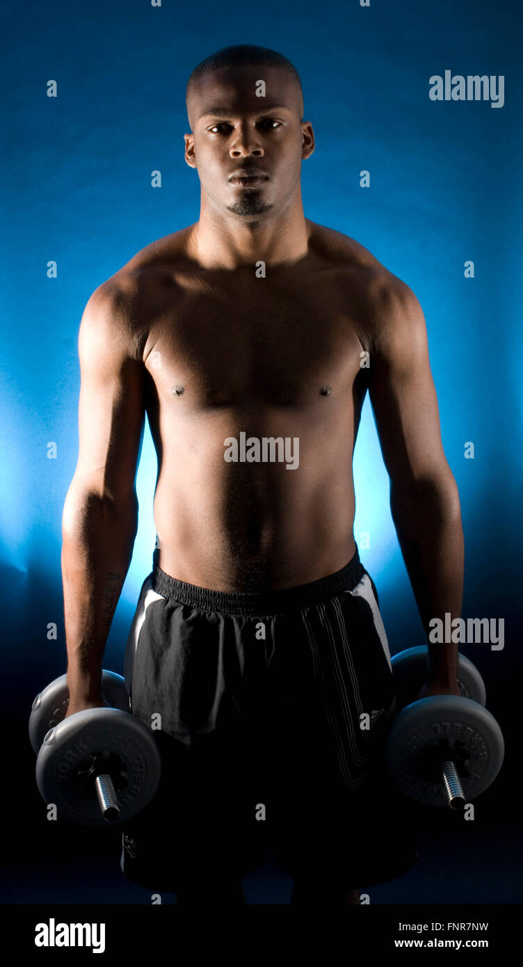 Man in great physical shape working out, toned muscles Stock Photo - Alamy