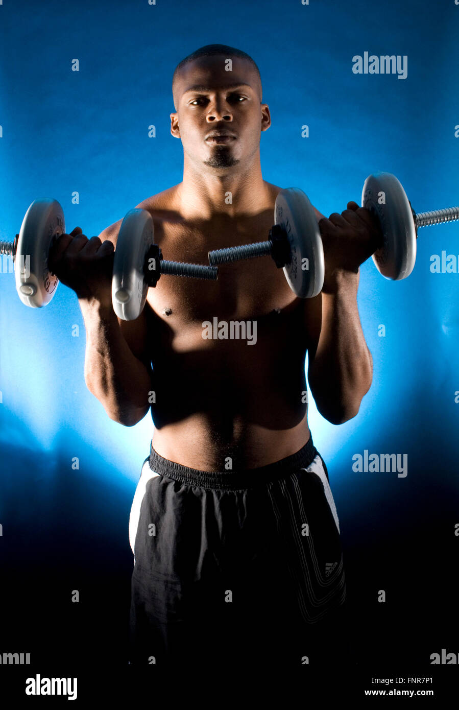 Man in great physical shape working out, toned muscles Stock Photo - Alamy