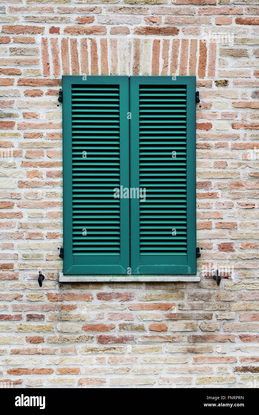 Green closed window on bricks wall Stock Photo - Alamy