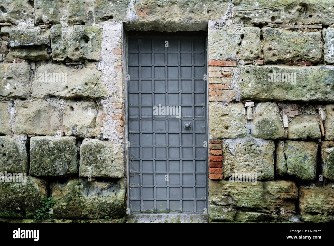 Old door in big stones wall Stock Photo - Alamy