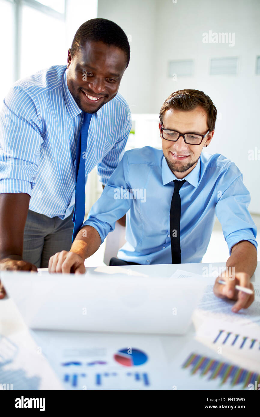 Two business people working in team at the office Stock Photo - Alamy