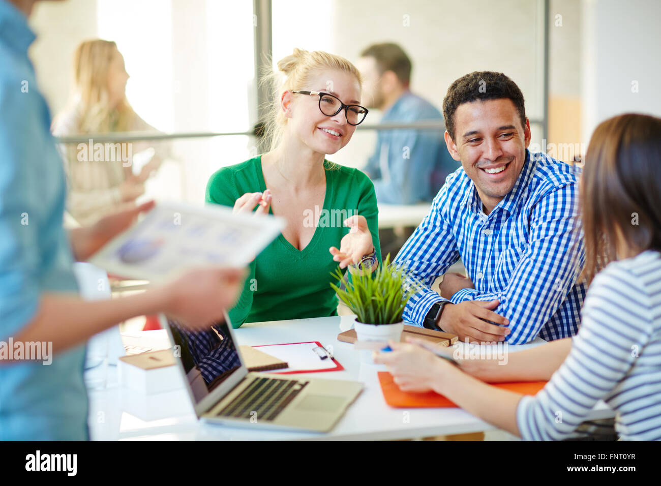 Group of business people laughing during a meeting Stock Photo - Alamy