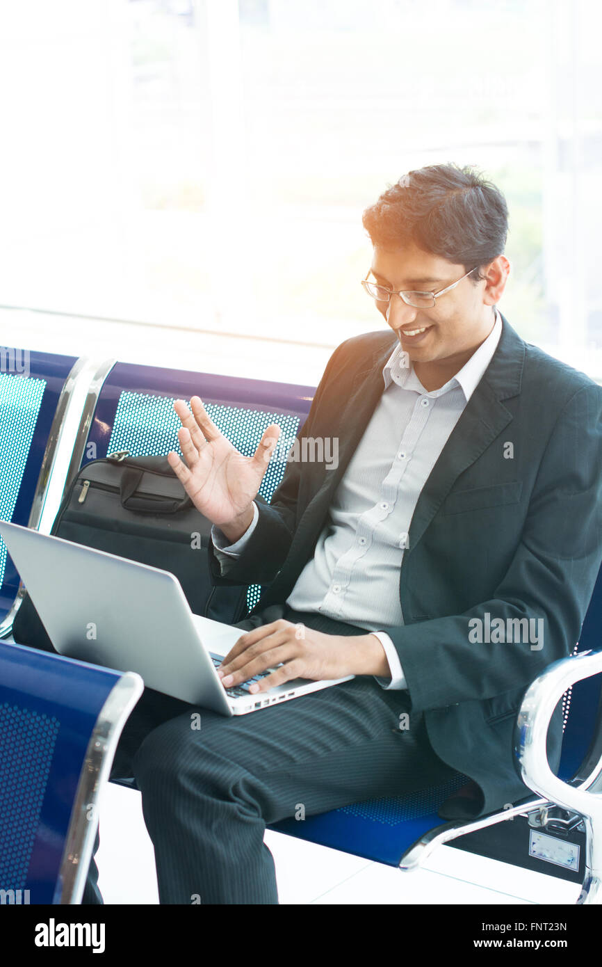 Asian Indian businessman using laptop computer Stock Photo - Alamy