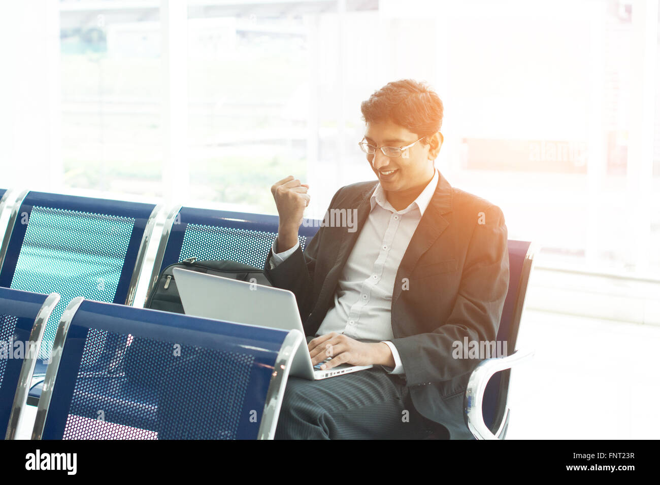Asian Indian businessman using laptop computer Stock Photo - Alamy