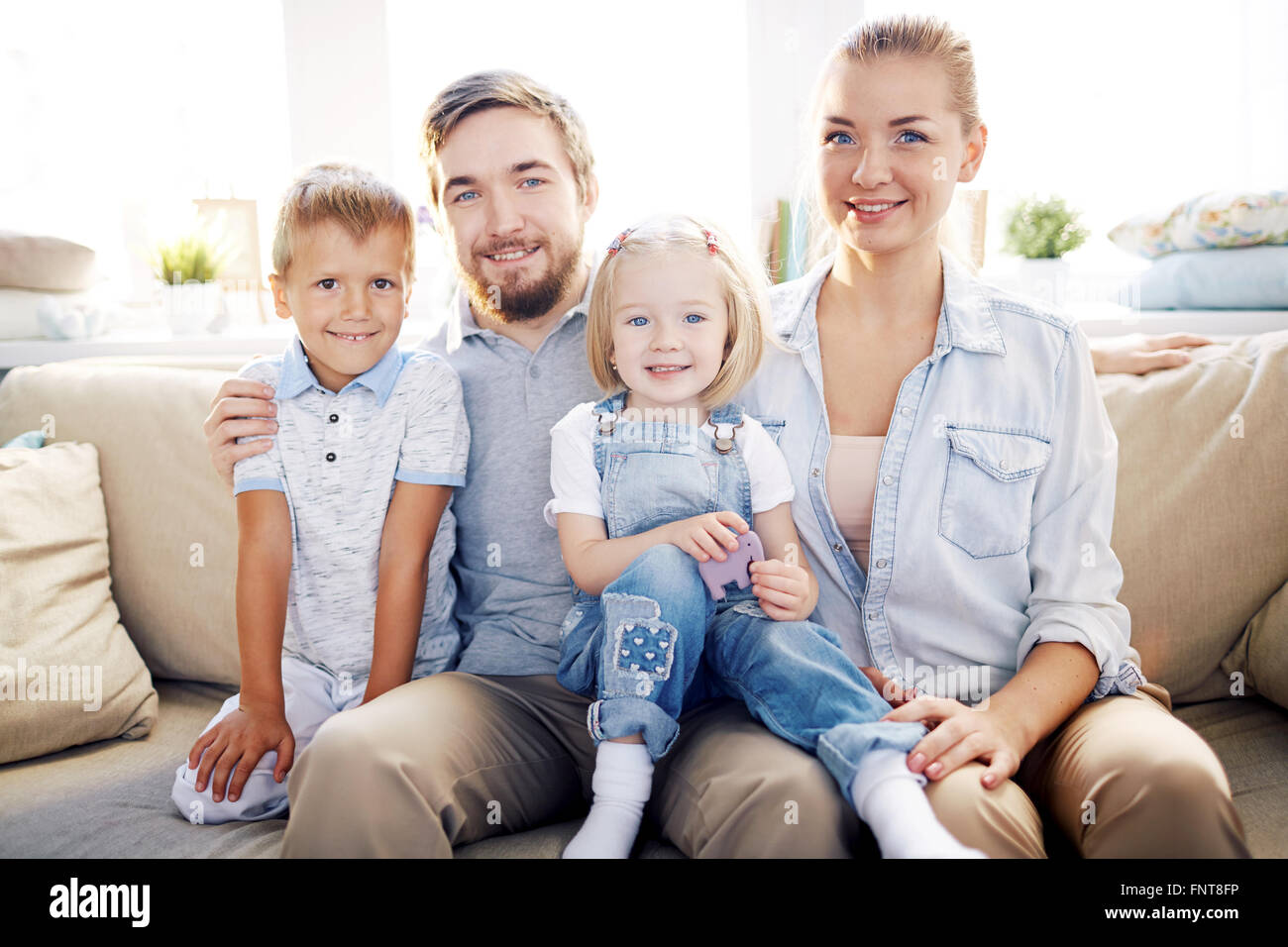 Cute kids embracing their happy parents Stock Photo - Alamy