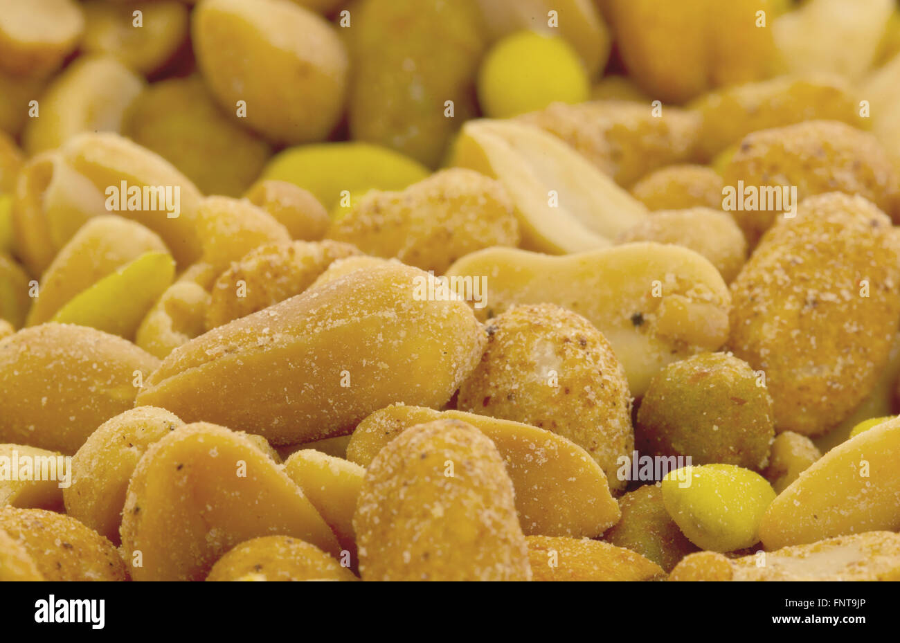 Fresh mixed salted nuts for backgrounds, peanut mix Stock Photo - Alamy