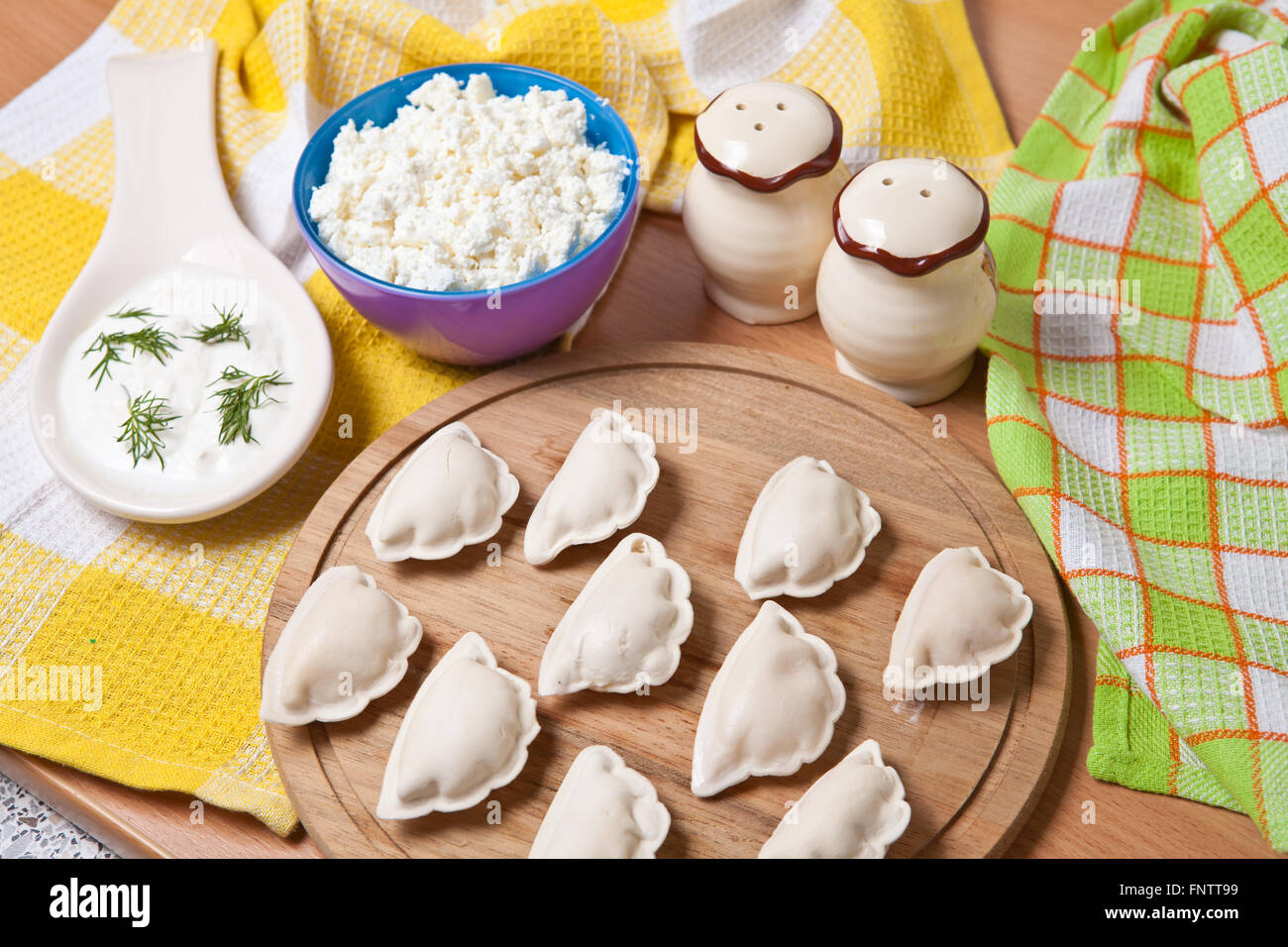 raw dumplings on a cutting board with cheese Stock Photo - Alamy