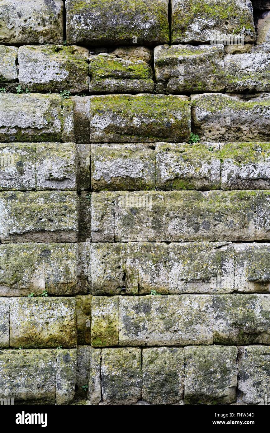 Vertical stones wall with drainage ditch Stock Photo - Alamy