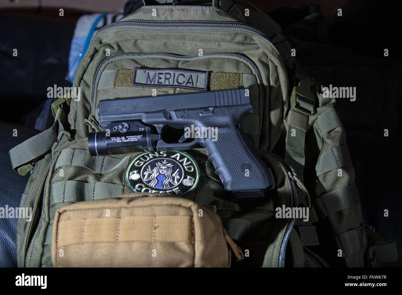 glock on a backpack Stock Photo - Alamy