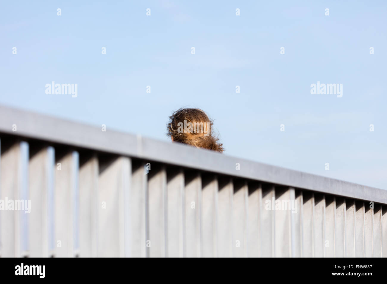 Girl behind fence hi-res stock photography and images - Alamy